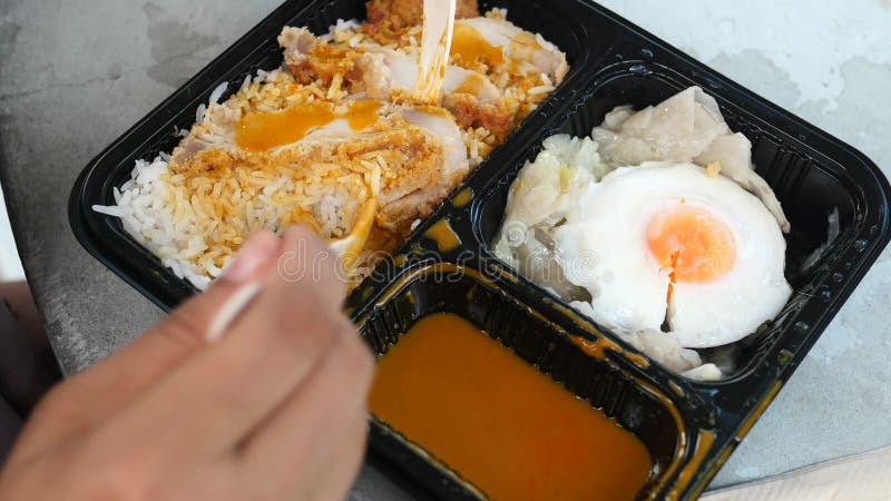 Curry Chicken and Rice in a Take Away Plastic Packet on Table Stock ...