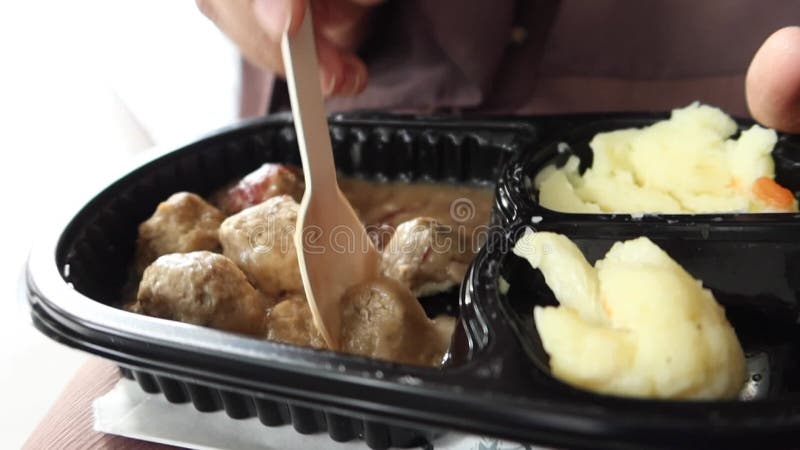 Curry Chicken and Rice in a Take Away Plastic Packet on Table Stock ...
