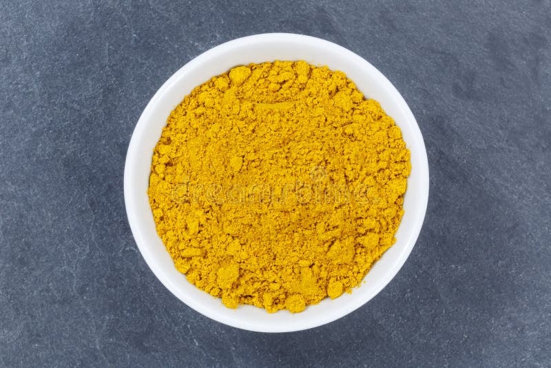 Curry Powder Spice from Above Bowl on a Slate Stock Image - Image of ...
