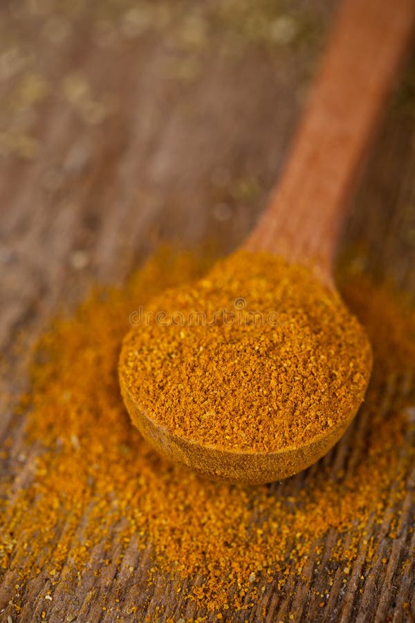 Curry Powder in Wooden Spoon Stock Image - Image of powder, cooking ...