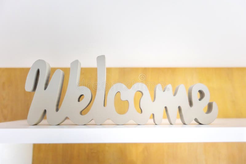 Cursive Welcome Sign on the Shelf Stock Photo - Image of christmas ...