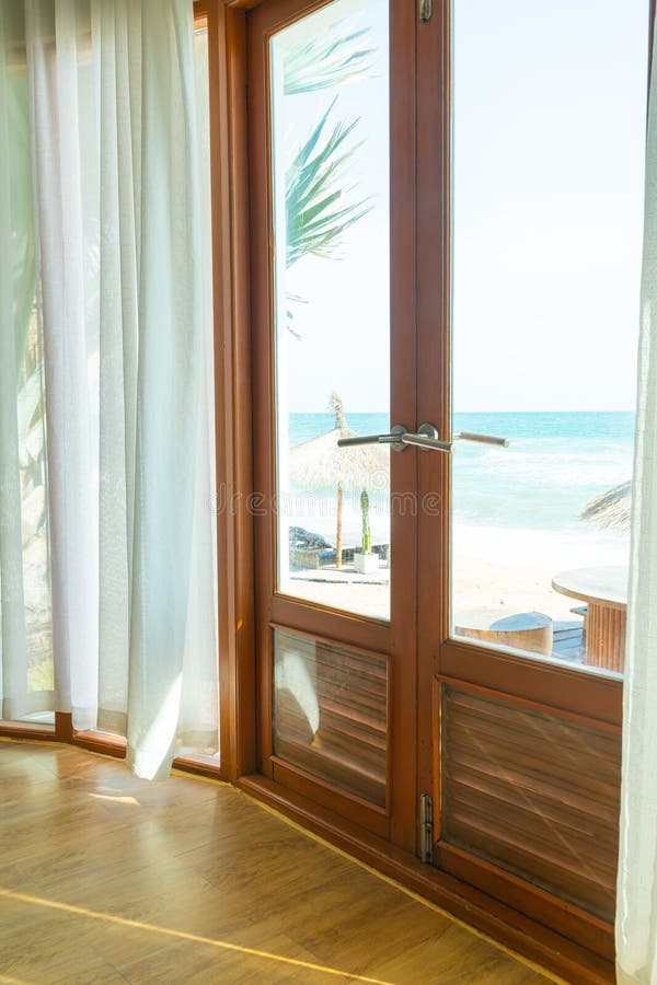 Curtain and Glass Window with Sea Beach View Outside Stock Photo ...