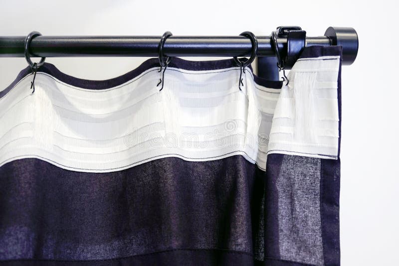The Curtain Hangs on a Horizontal Bar. Against the White Wall Stock ...