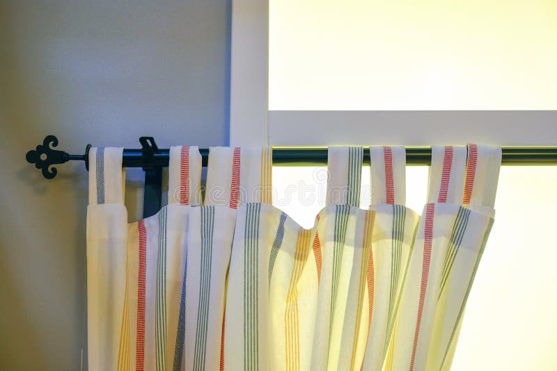 The Curtain Hangs on a Horizontal Bar. Against the White Wall Stock ...