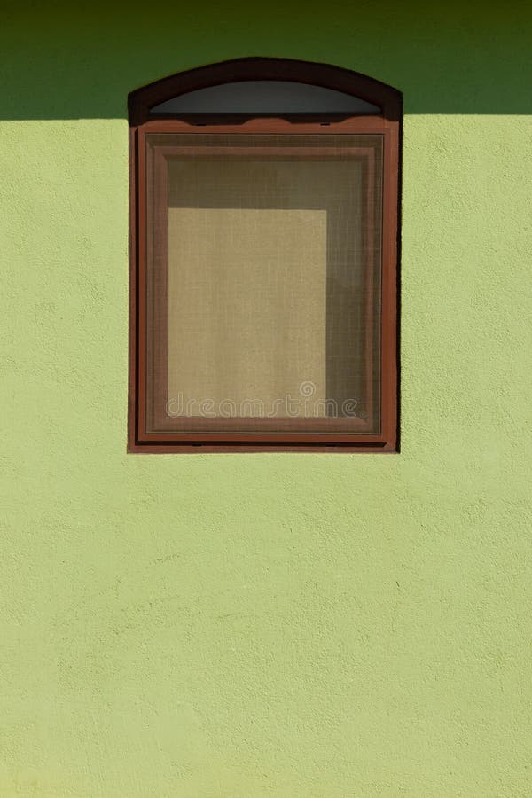 Curtained Brown Window on a Green Textured Wall with a Mosquito Net in ...