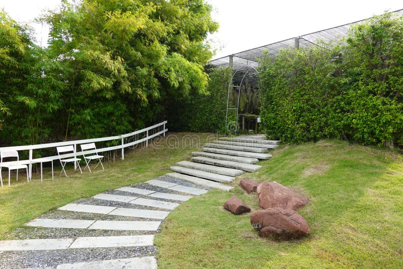 Curve Walkway Made Stone Path in the Garden. Tropical Garden Stock ...