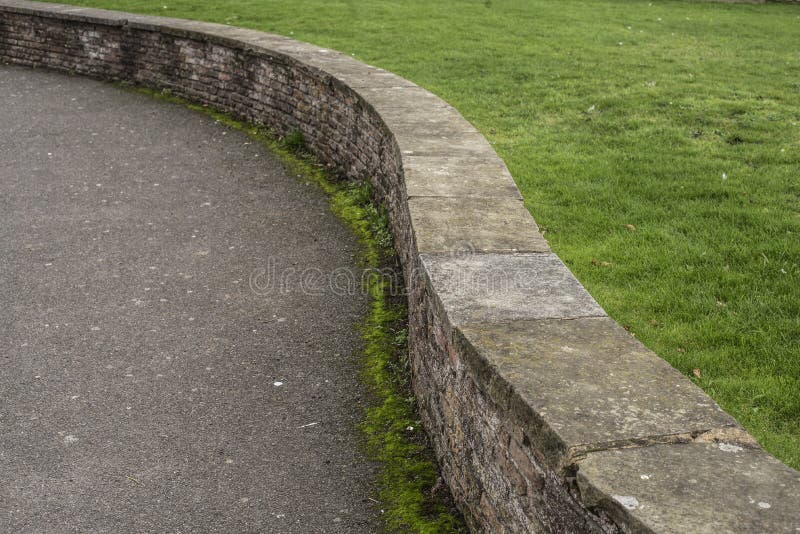 A Curved Brick Wall in a Public Park Stock Image - Image of dividing ...