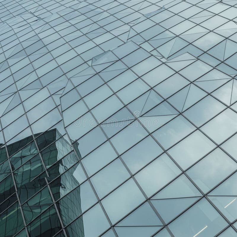 Curved Glass Facade of a Modern Skyscraper, Showcasing a Geometric Grid ...