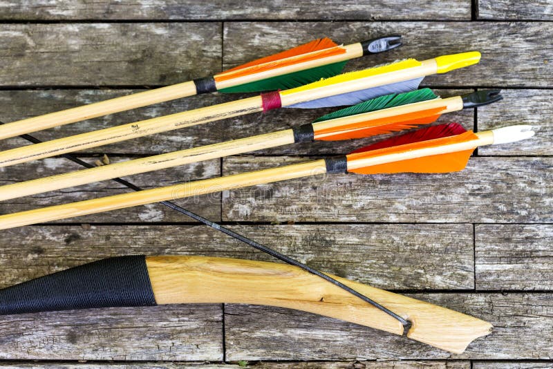Bow and Arrow Next To Each Other Stock Photo - Image of feather, hunter ...
