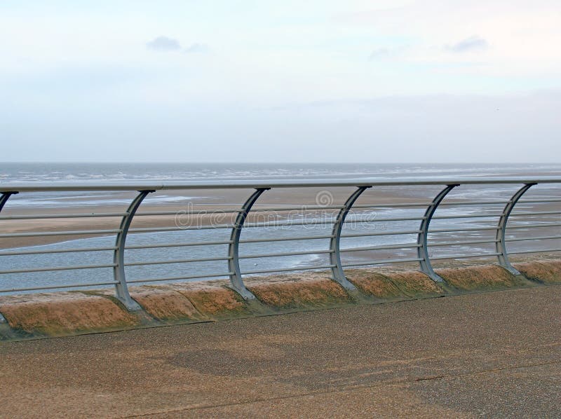 Curved Metal Railings on the Seafront in Blackpool with Waves Breaking ...