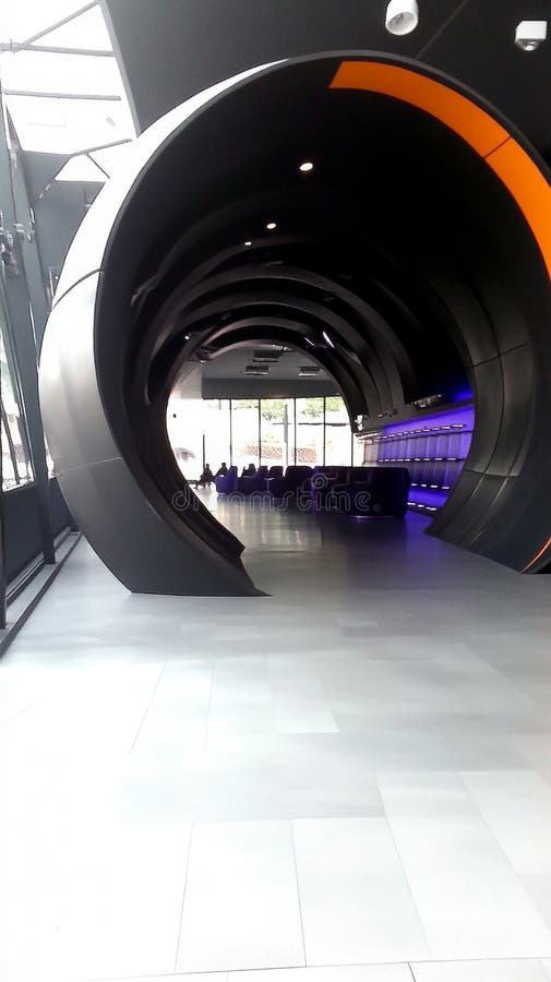 Curved Modern Seating in Orange is Set Against a Backdrop of Minimalist ...