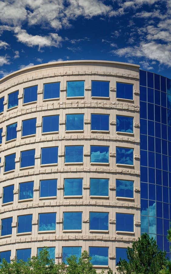 Curved Office with Clouds Reflected in Glass Stock Image - Image of ...