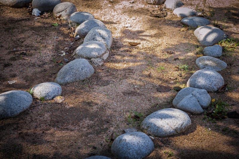 Curved Path Marked by Stones on Both Sides Stock Image - Image of ...