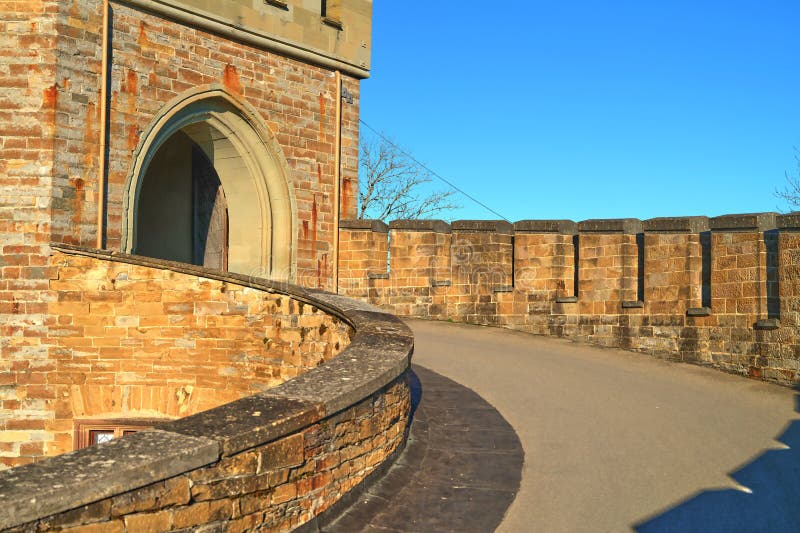 Curved Pathway within Castle Walls Under Clear Sky Stock Image - Image ...