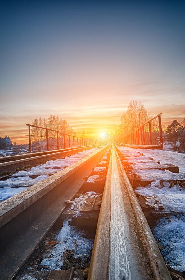 Curved railroad in sunset stock photo. Image of bridge - 86324698