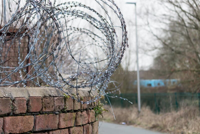 Curved Wall and Barbed Wire Stock Image - Image of greater, industrial ...