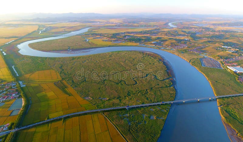 A curved river stock image. Image of shore, blue, bridge - 108577691