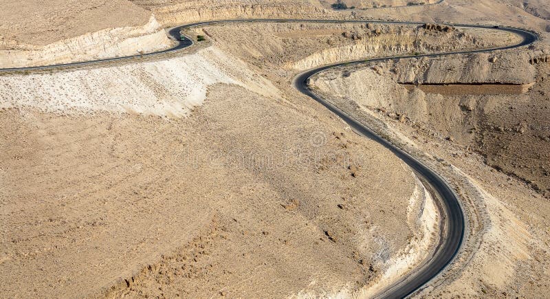 Curved road in the desert stock photo. Image of nature - 185787044