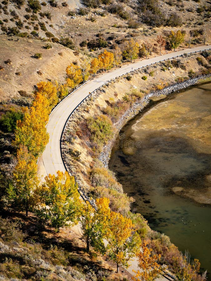 Curved Road Lined with Fall Colored Trees Stock Image - Image of peak ...