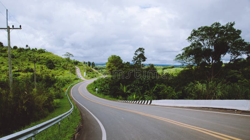 Long Rural Country Road Through Tall Grass Pasture Stock Image - Image ...