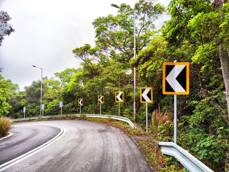 Curved Road Warning Signs Guide Drivers Along a Winding Route ...