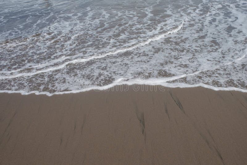 The Curved Shape of the Waves on the Beach Sand Stock Photo - Image of ...