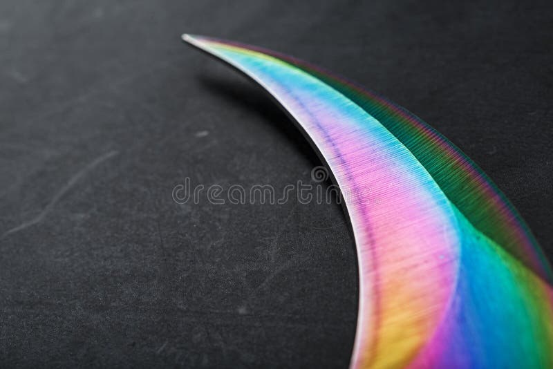 The Curved Sharp Blade of the Kerambit Dagger is a Gradient Rainbow ...