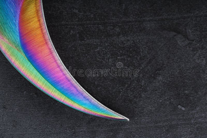 The Curved Sharp Blade of the Kerambit Dagger is a Gradient Rainbow ...