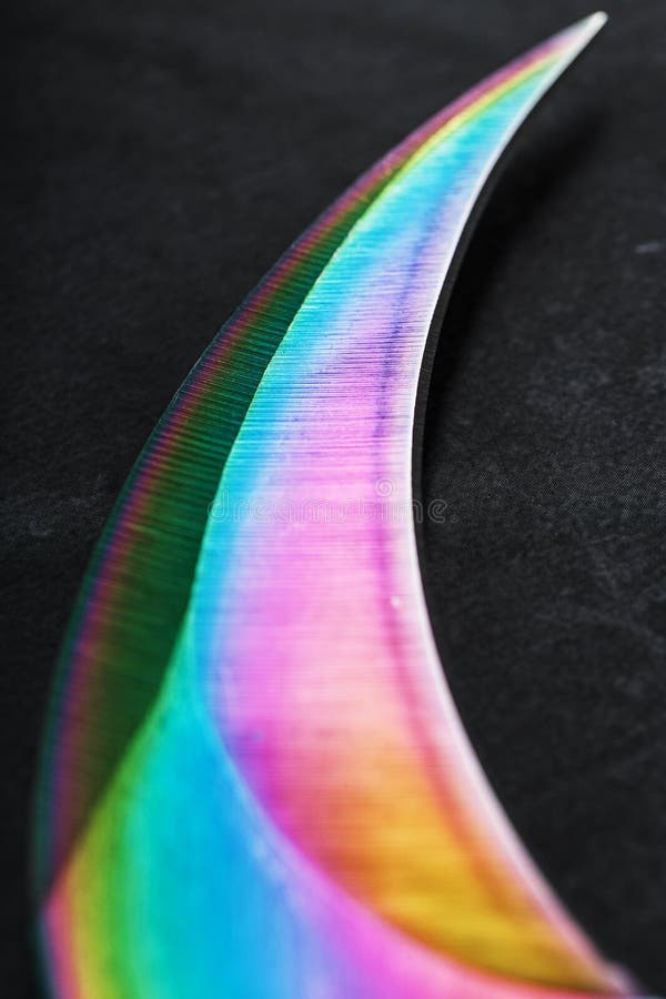 The Curved Sharp Blade of the Kerambit Dagger is a Gradient Rainbow ...