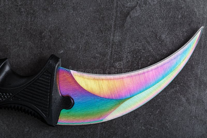The Curved Sharp Blade of the Kerambit Dagger is a Gradient Rainbow ...