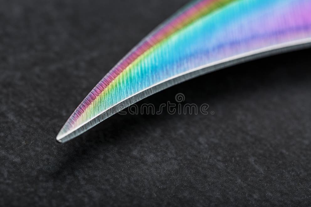 The Curved Sharp Blade of the Kerambit Dagger is a Gradient Rainbow ...