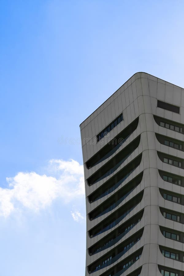 Curved Skyscraper with Long Balcony, Blue Sky with One Cloud Stock ...
