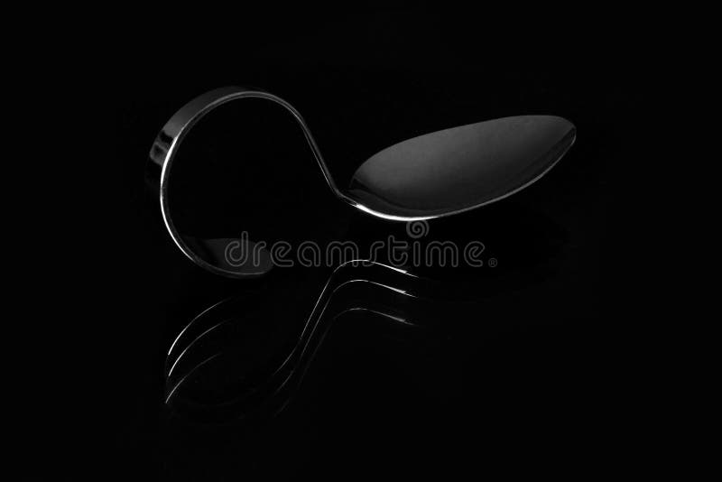 Curved spoon stock photo. Image of chrome, smooth, detail - 147977634
