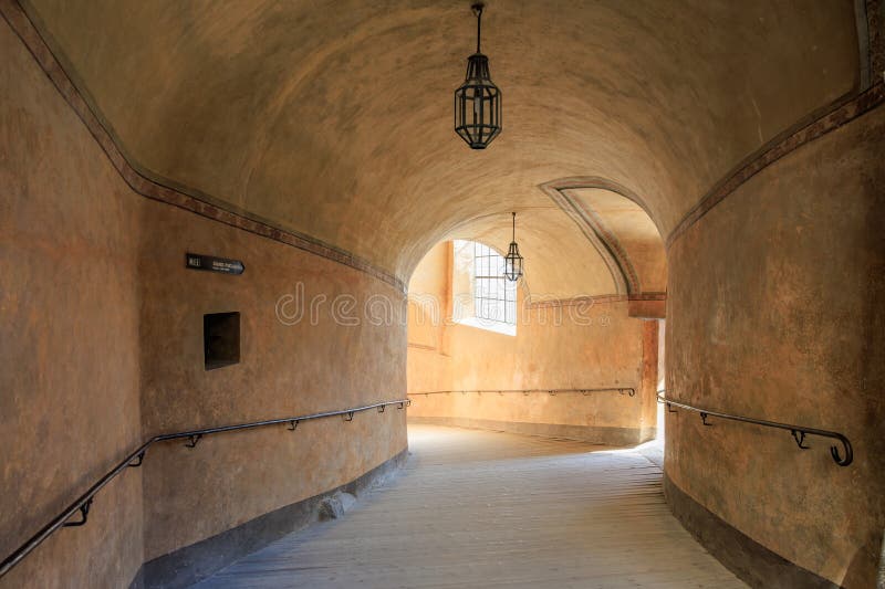Curved Stone Corridor with Arched Ceiling and Hanging Lanterns. March ...