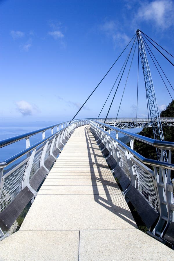 Curved Suspension Bridge stock photo. Image of curve, cloud - 1557062