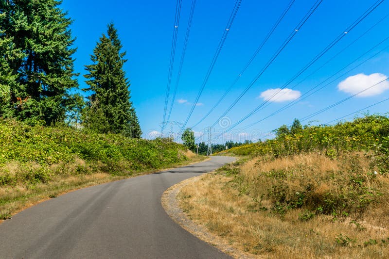 Curved Walking Path through Transmission Lines Stock Photo - Image of ...