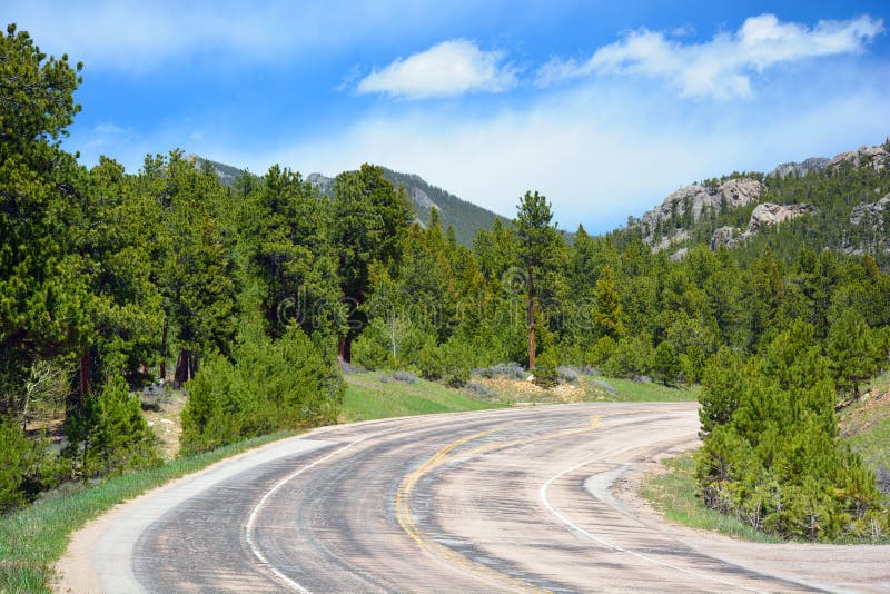 Curved Weathered Asphalt Mountain Road on a Sunny Day Stock Image ...