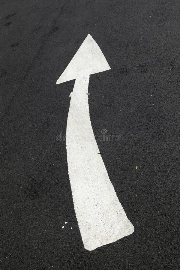 Curved White Arrow on a Black Tarmac Road. Stock Image - Image of paint ...