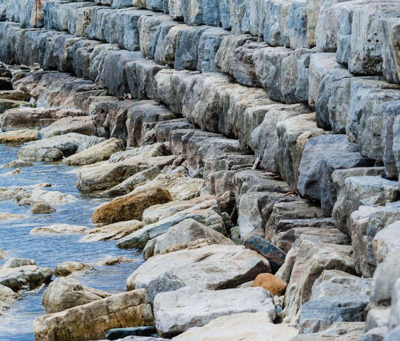 Curving Breakwall of Stacked Stones. Stock Photo - Image of navigation ...