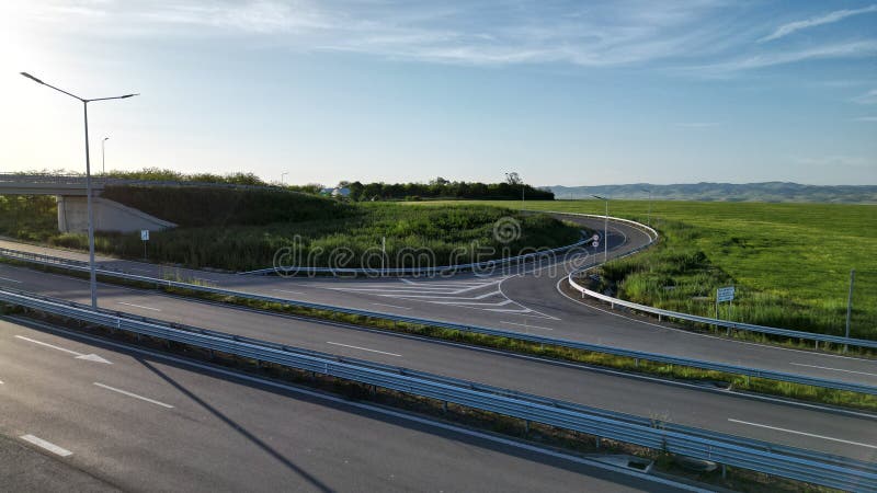 Curving Highway Lush Green Field Stock Photos - Free & Royalty-Free ...