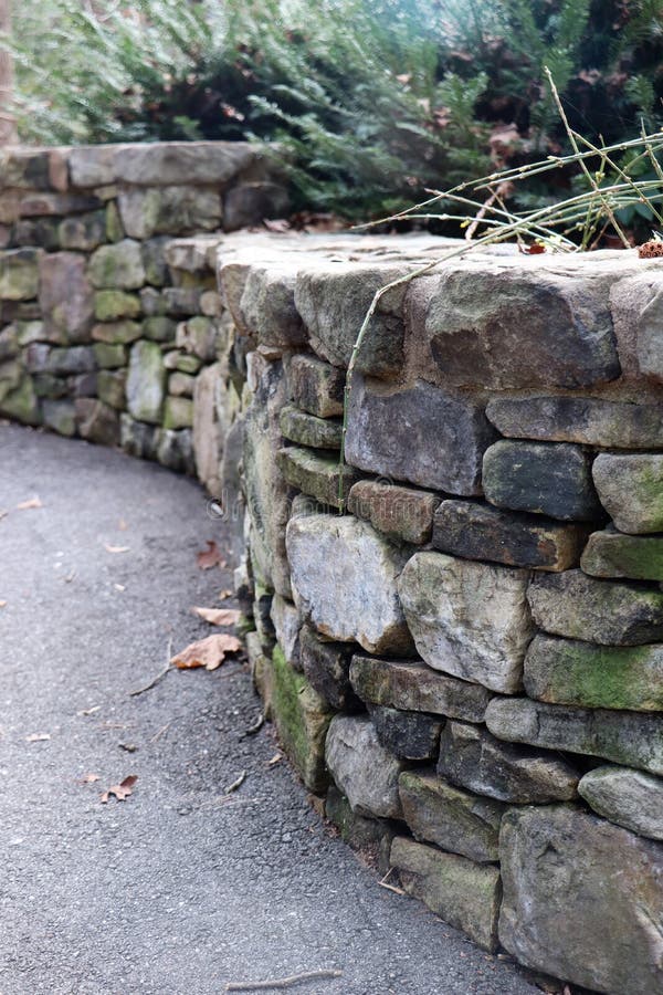 Curving Stone Wall, Vertical Stock Image - Image of brickwork, trunk ...
