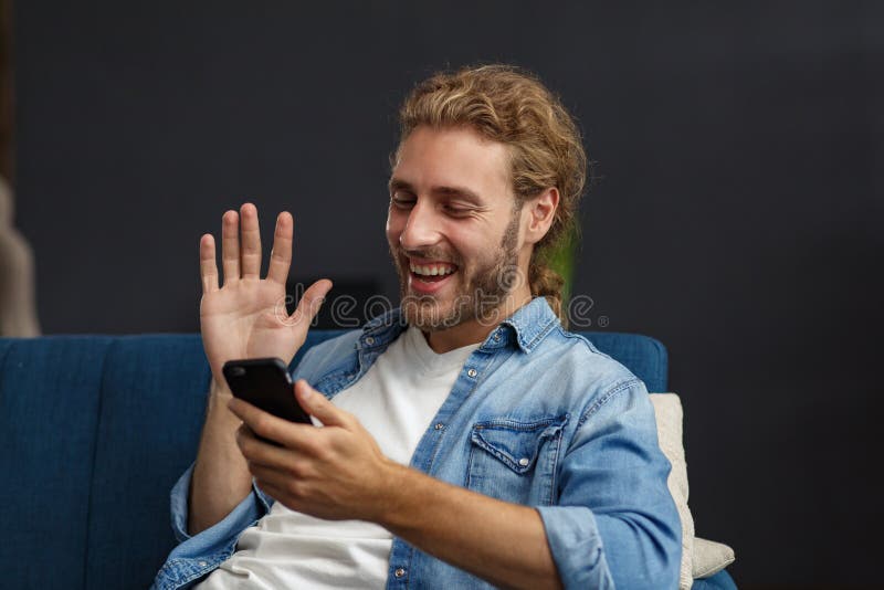 Curvy Guy Using Smartphone And Smiling Happy Man Using Mobile Phone