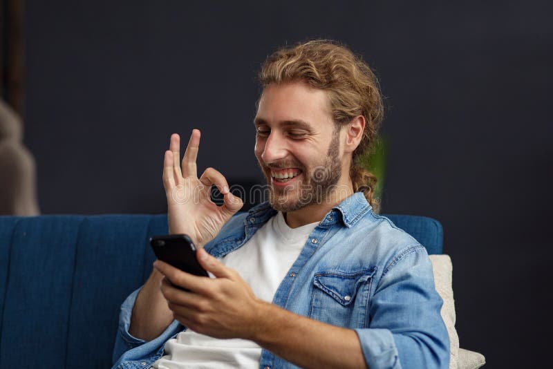 Curvy Guy Using Smartphone and Smiling. Happy Man Using Mobile Phone ...