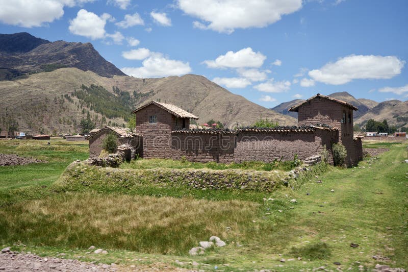 Traditional Mud Block Building with Mountains Behind. Cusco, Peru ...