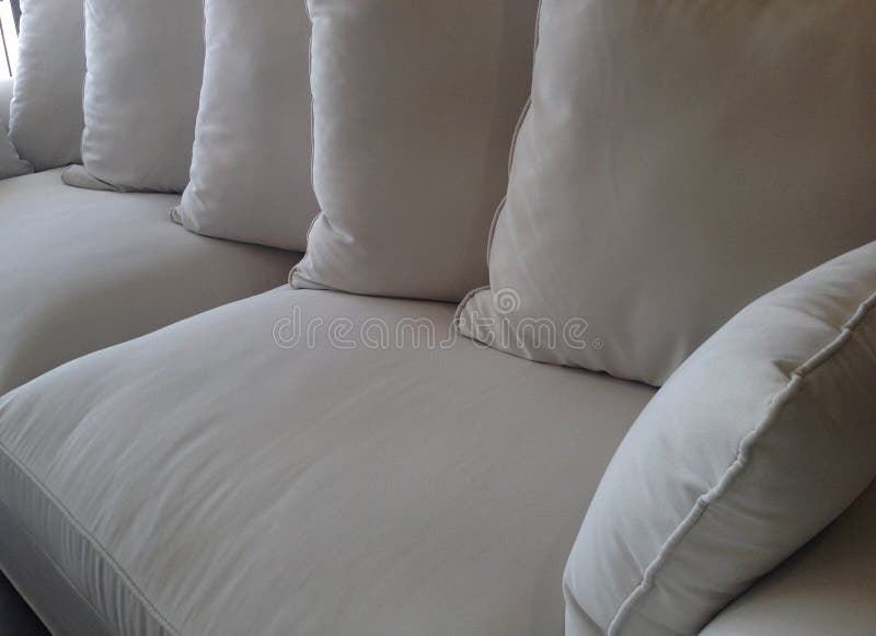 Cushions on sofa detail stock photo. Image of simple - 65576340
