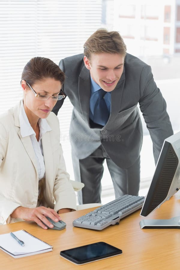 Cusiness Couple Using Computer at Office Desk Stock Image - Image of ...