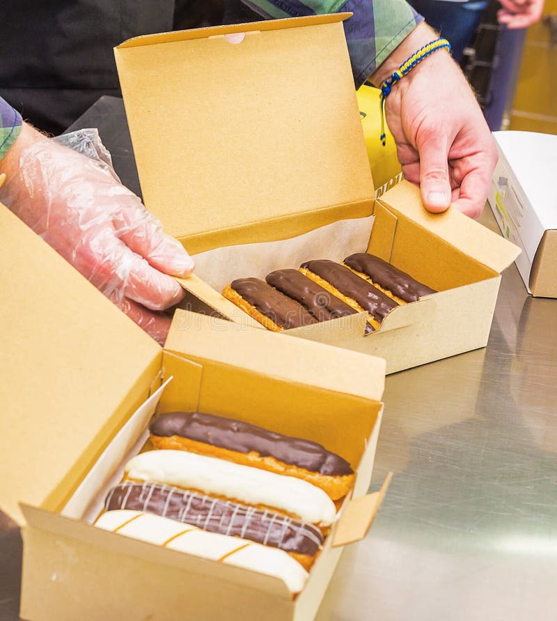 Custard Eclairs with Dark and Light Chocolate in a Box Stock Photo ...