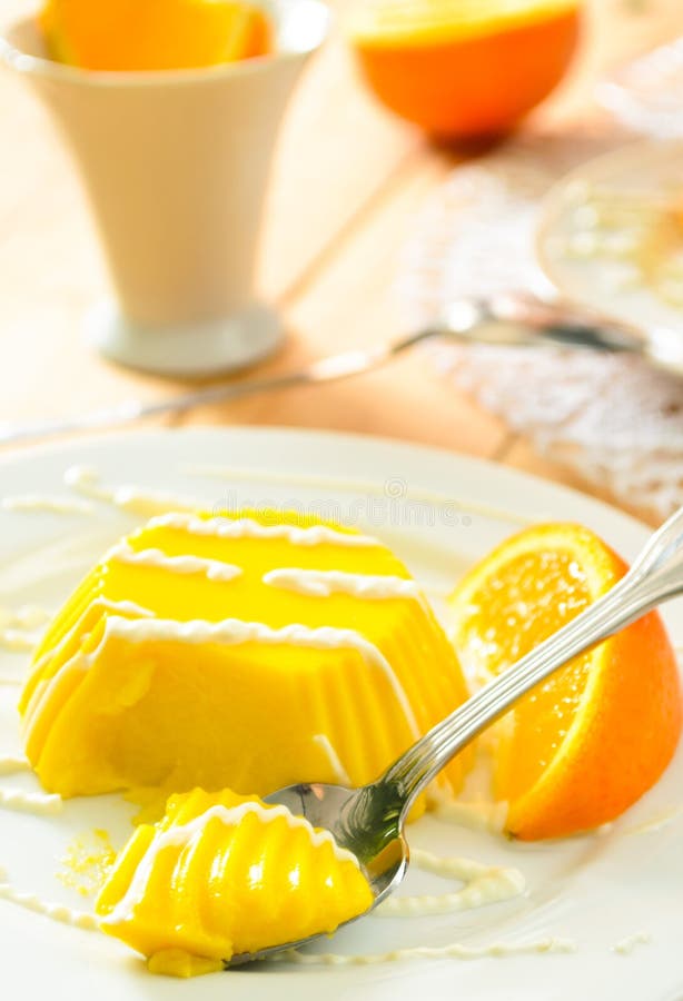 Custard Pudding with Vanilla Sauce and Orange Stock Photo - Image of dessert, hand: 60110310