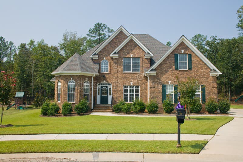 Custom brick home 7 stock image. Image of lawn, large - 4483971