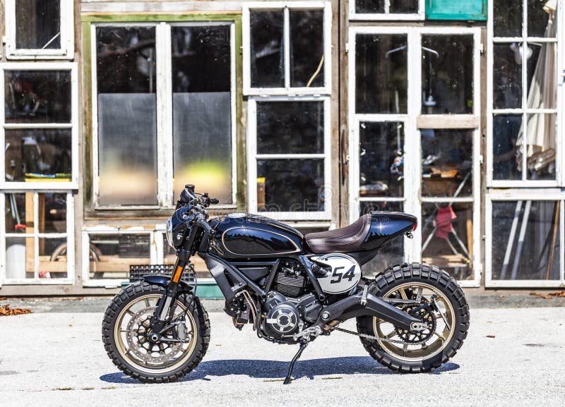 Custom Made Scrambler Style Cafe Racer with Standing in Front of Stock ...